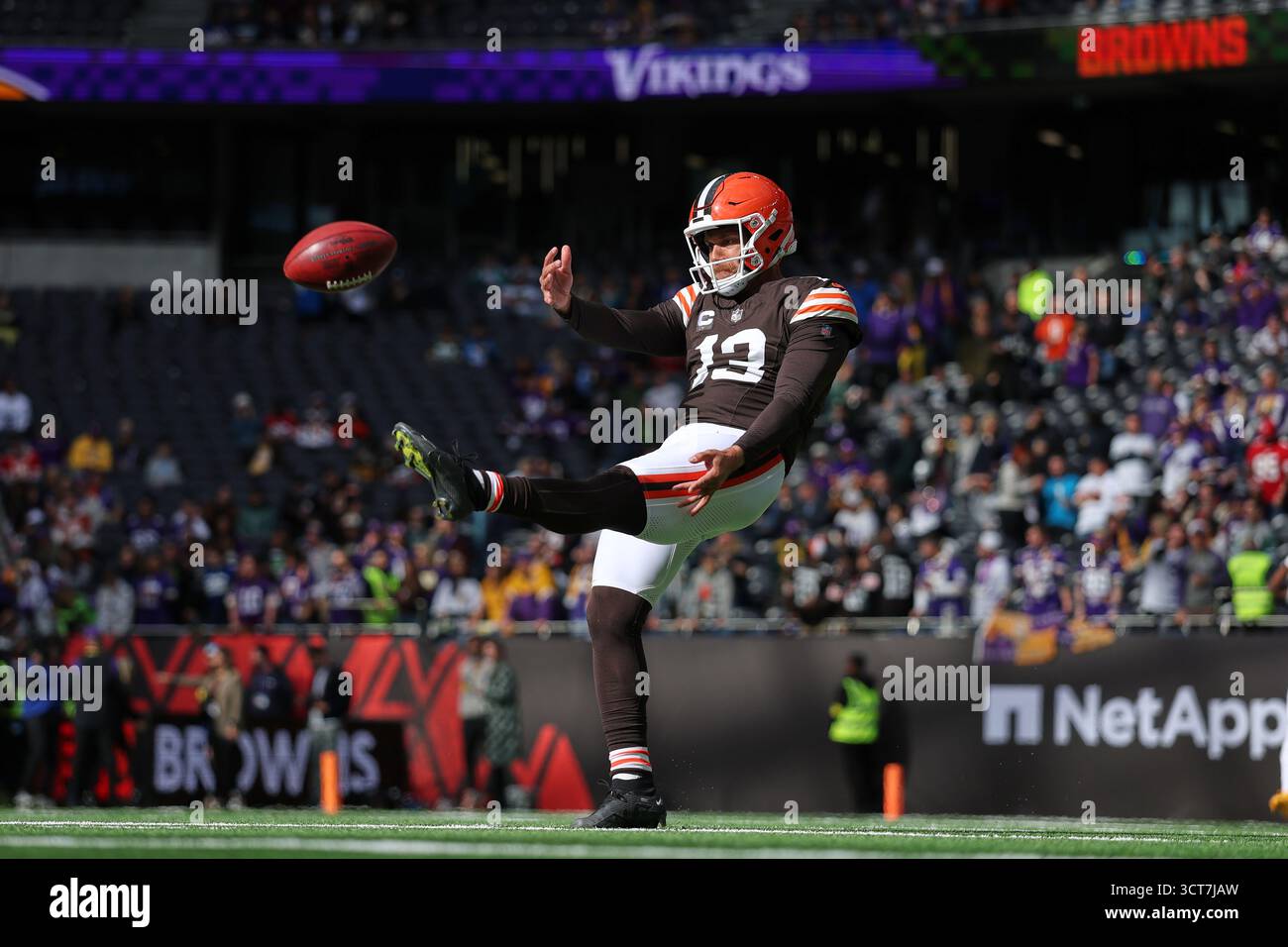 Cleveland Browns punter Corey Bojorquez (13) kicks the ball as he warms ...