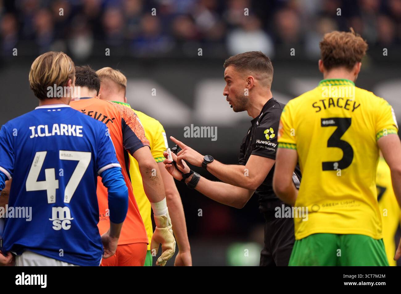 Referee Thomas Kirk holding a cigarette lighter that was thrown from ...