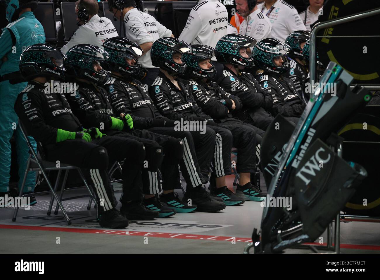 Mercedes crew follow the race in their garage during the Singapore ...