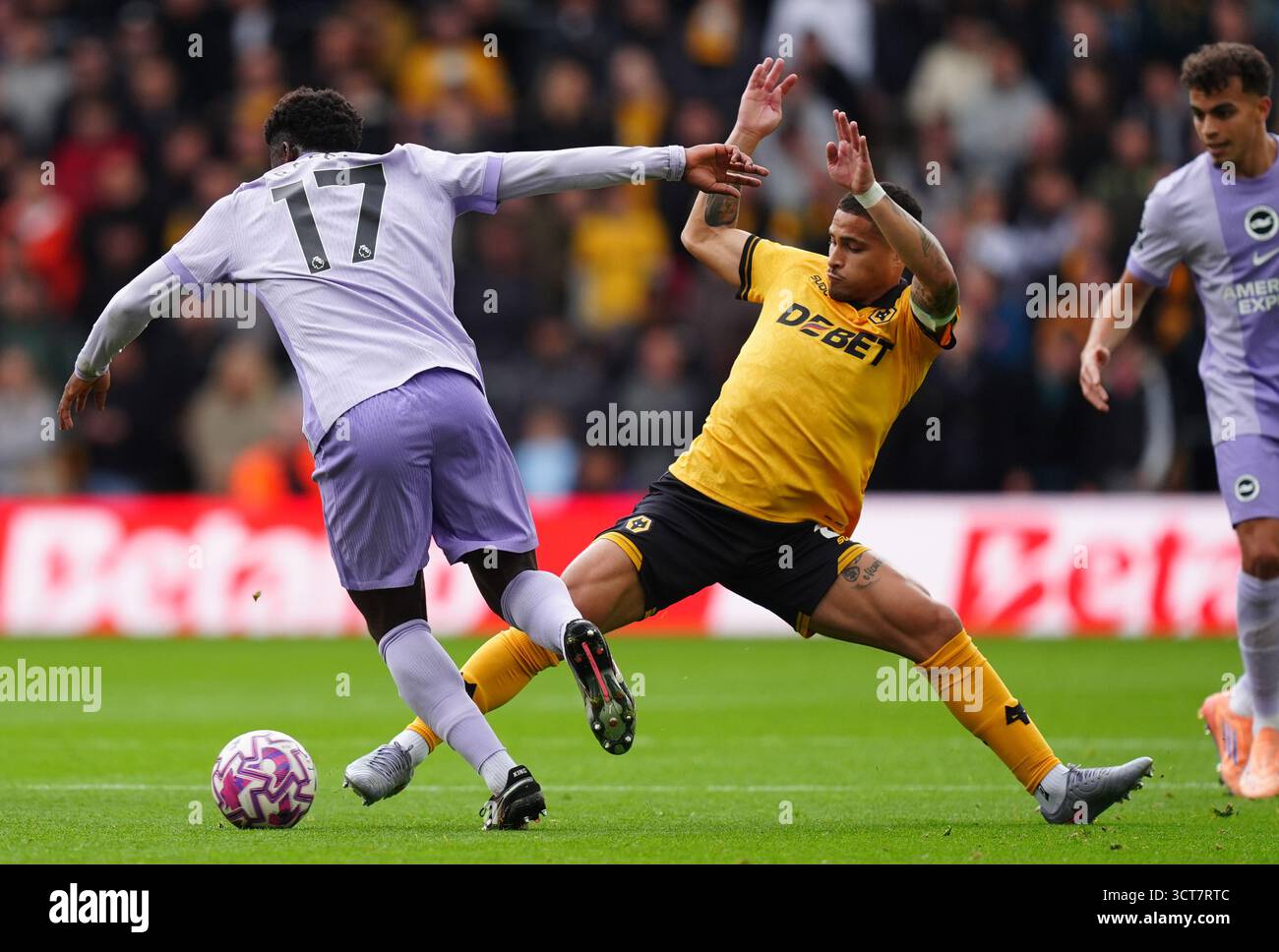 Brighton and Hove Albion's Carlos Baleba (left) and Wolverhampton ...