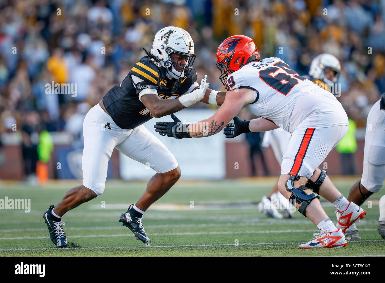 Appalachian State defensive lineman Thomas Davis, left, battles Oregon ...