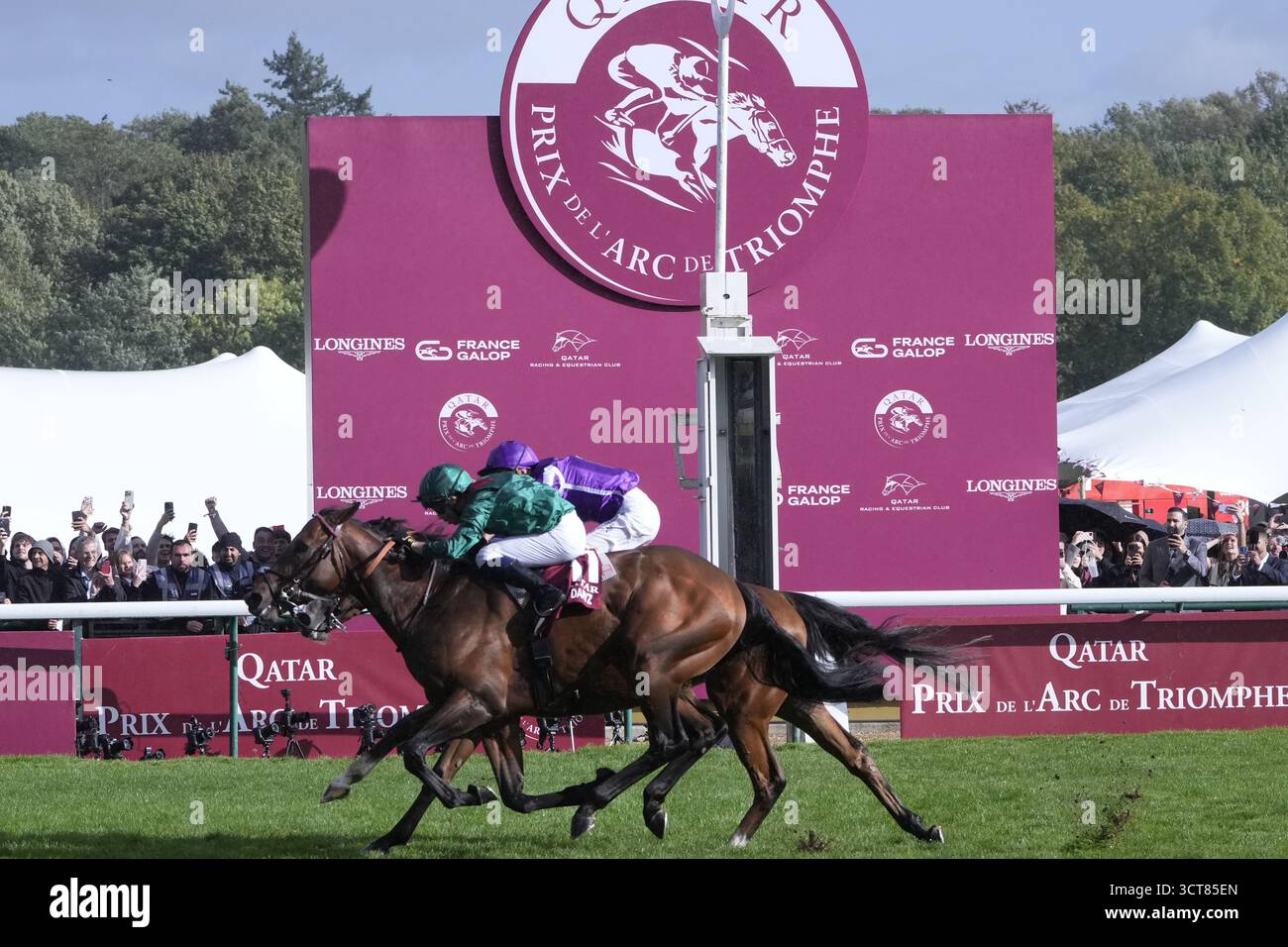 Daryz (11) ridden by Mickael Barzalona crosses the finish line to win ...