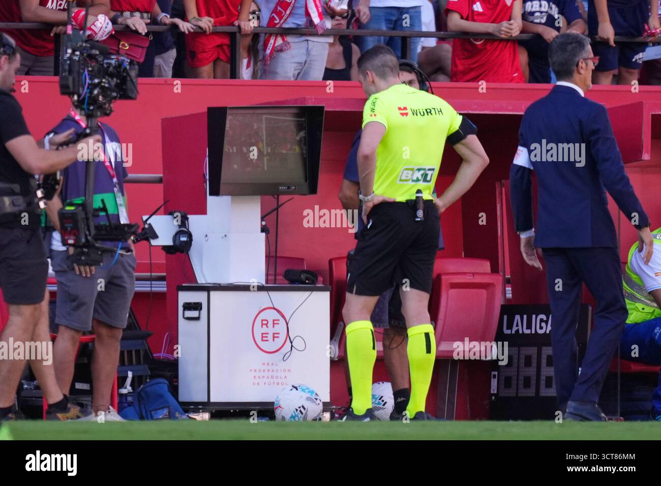 Referee Alejandro Muniz Ruiz pauses the match and checks the VAR screen ...