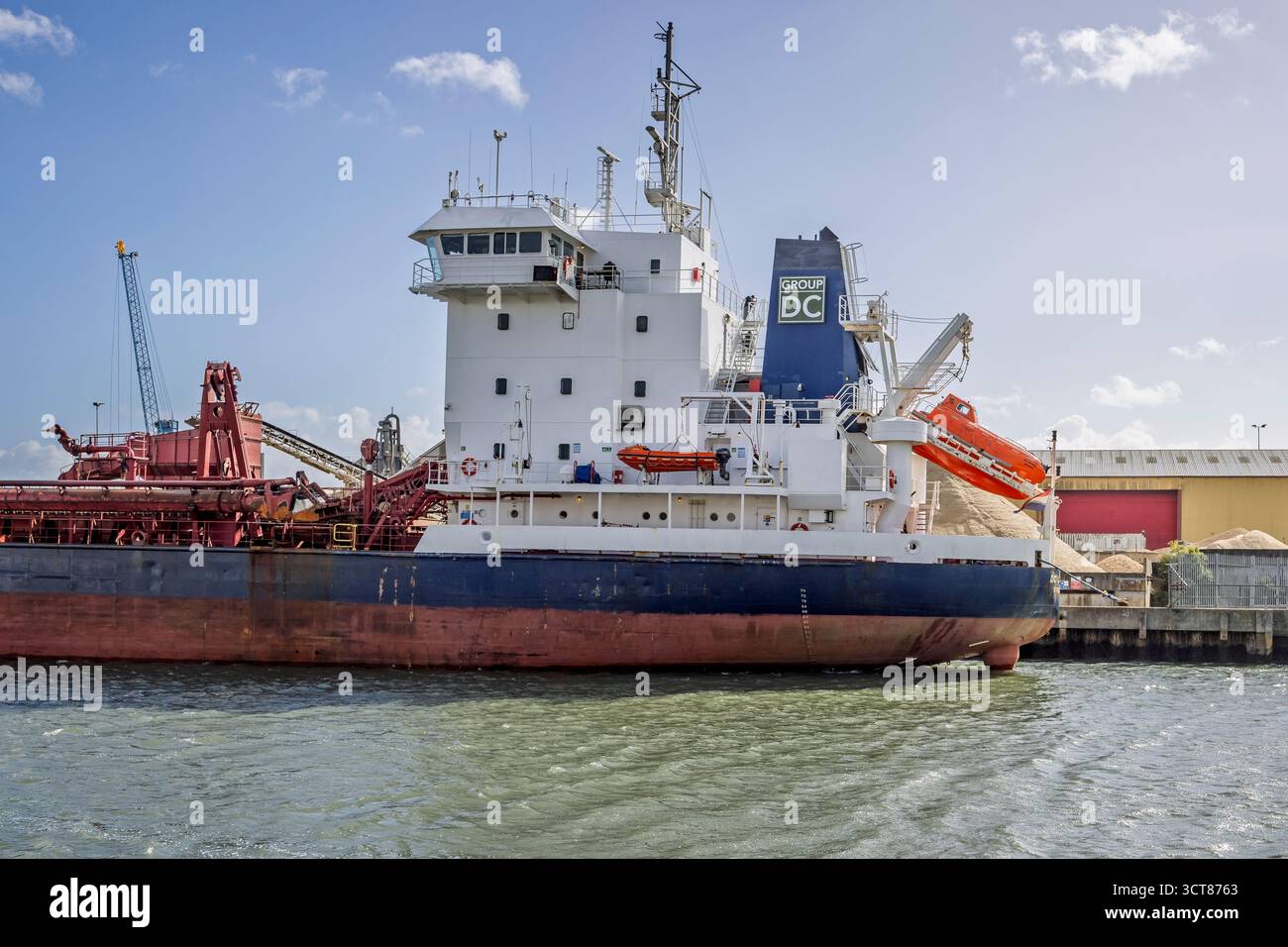 The dredging vessel DC Ostend with orange lifeboat on ramp at rear of ...