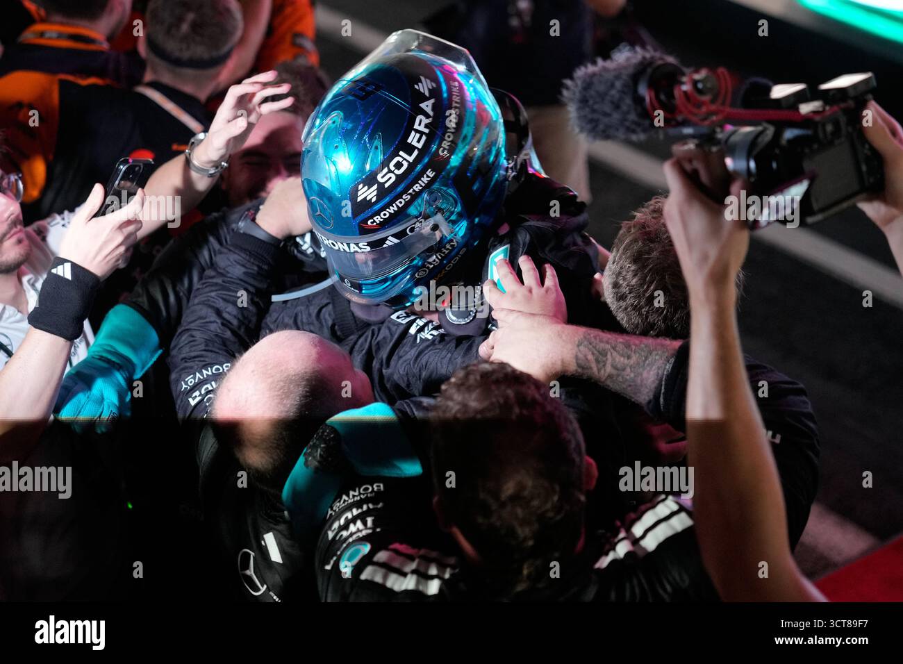 Mercedes driver George Russell of Britain celebrates with his team fter ...