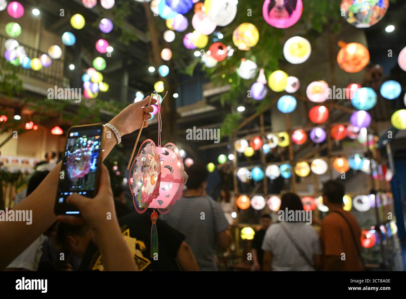 People take photo with the mid autumn festival lanterns at the Blue House on October 5, 2025 in ...