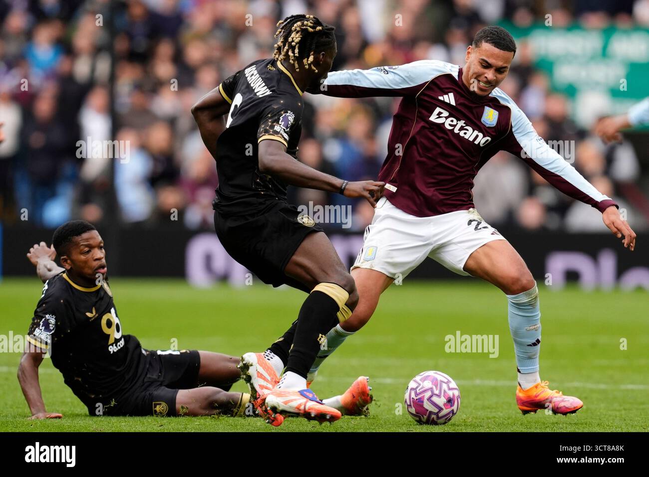 Burnley's Lesley Ugochukwu (centre) and Aston Villa's Morgan Rogers ...