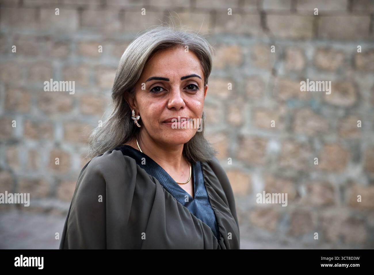 Kurdish health worker Dr. Rankin Abdow poses for a photo after winning ...