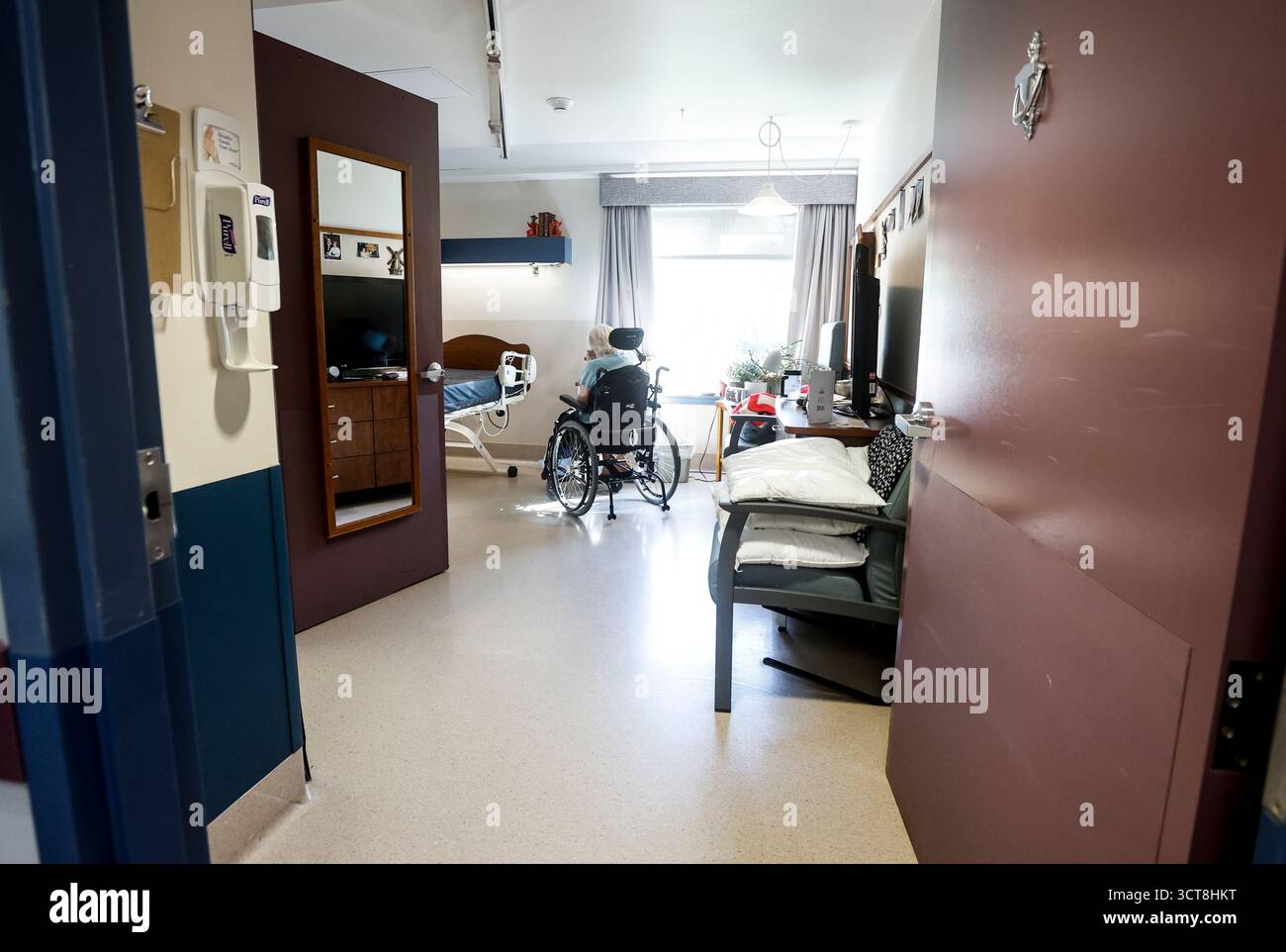 A resident at Misericordia Place Personal Care Home (MPPCH) waits to be ...