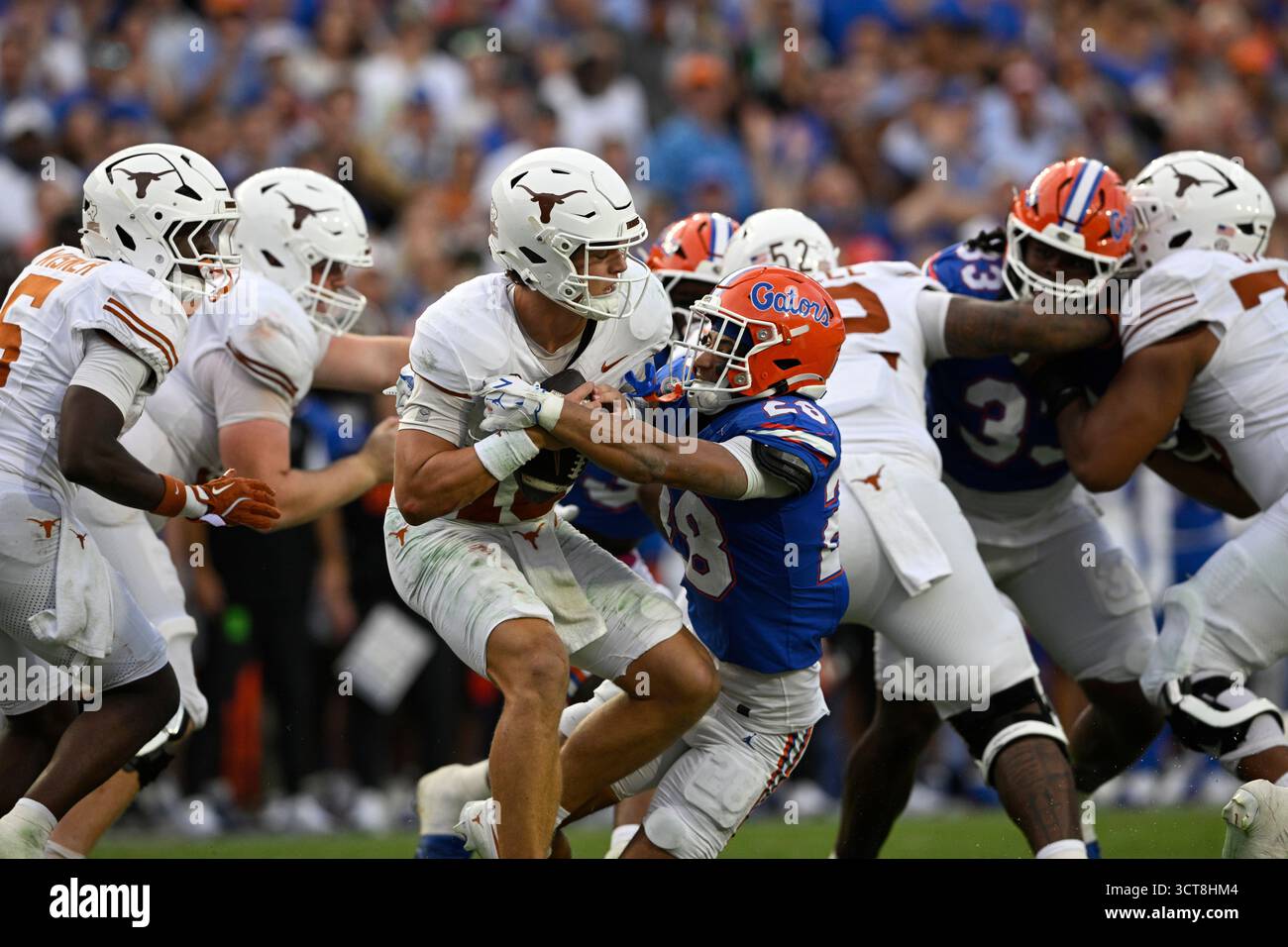 Texas quarterback Arch Manning (16) is sacked by Florida defensive back ...