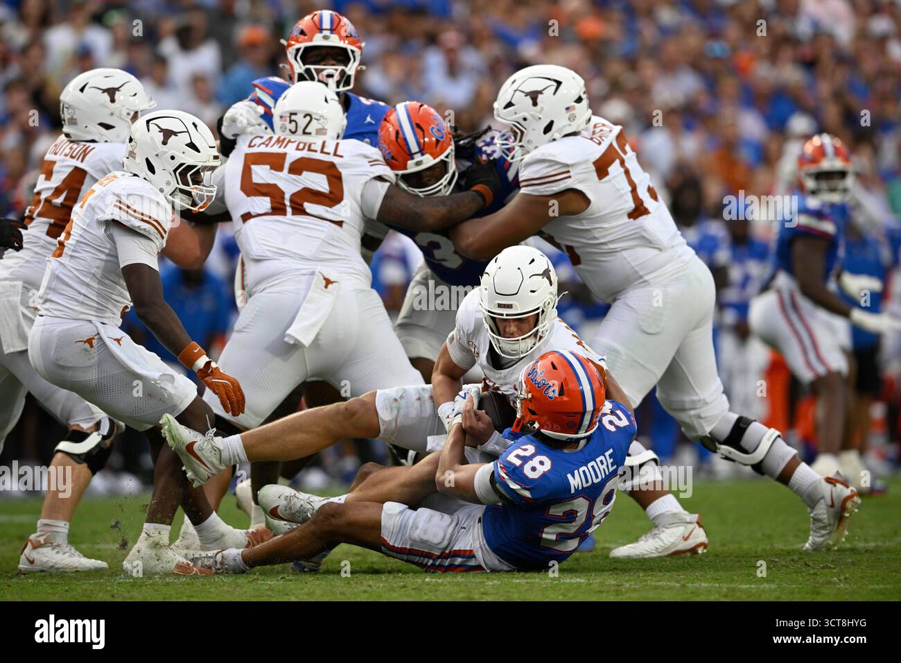 Texas quarterback Arch Manning (16) is sacked by Florida defensive back ...