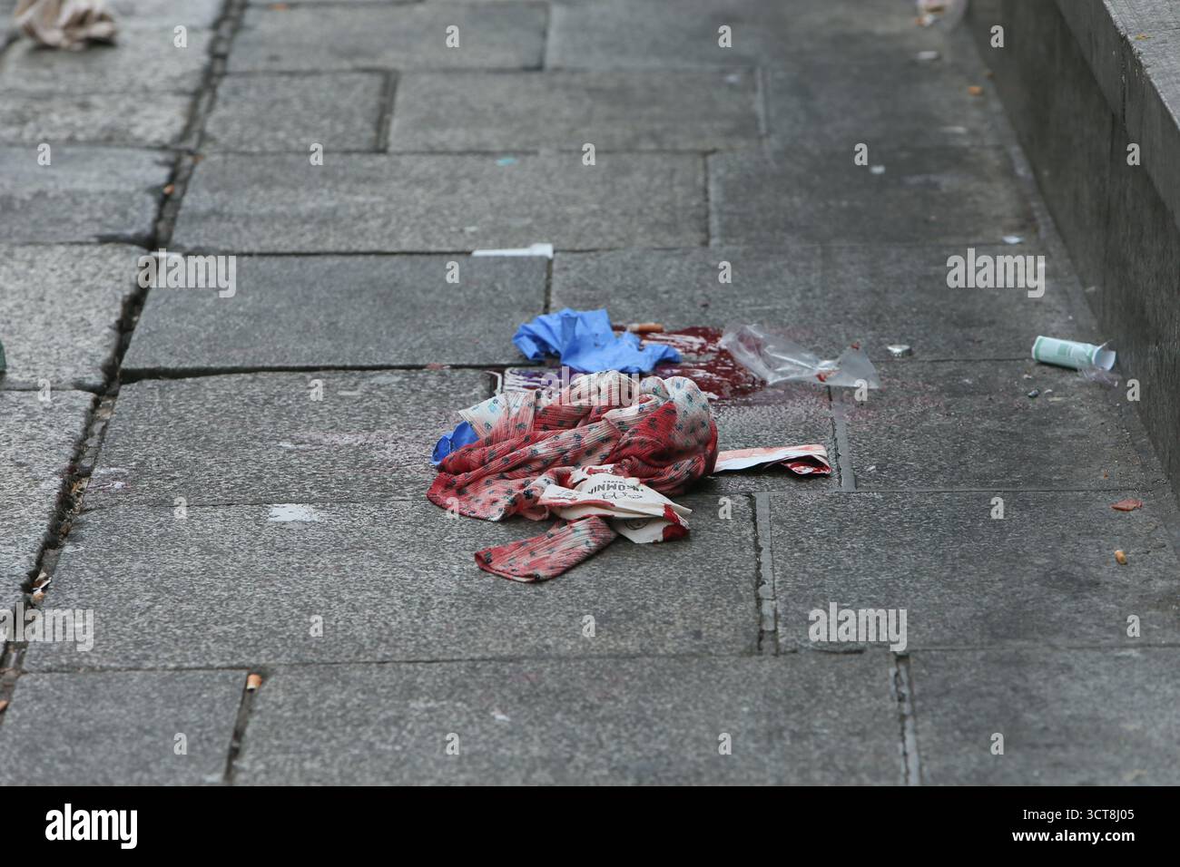 Dublin, Ireland - 14th August 2025 - A blood soaked rag on a footpath ...