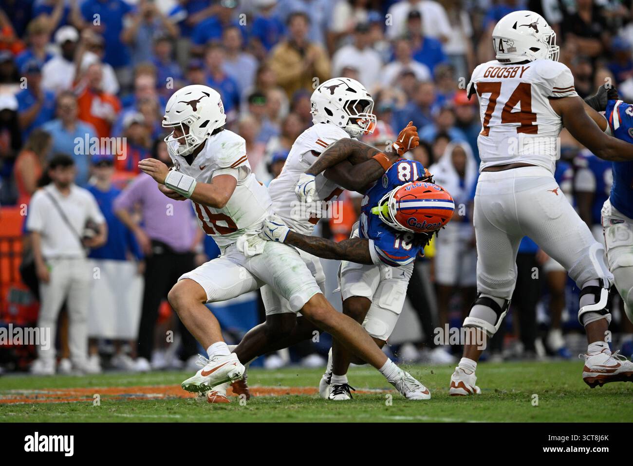 Texas quarterback Arch Manning (16) escapes from Florida defensive back ...