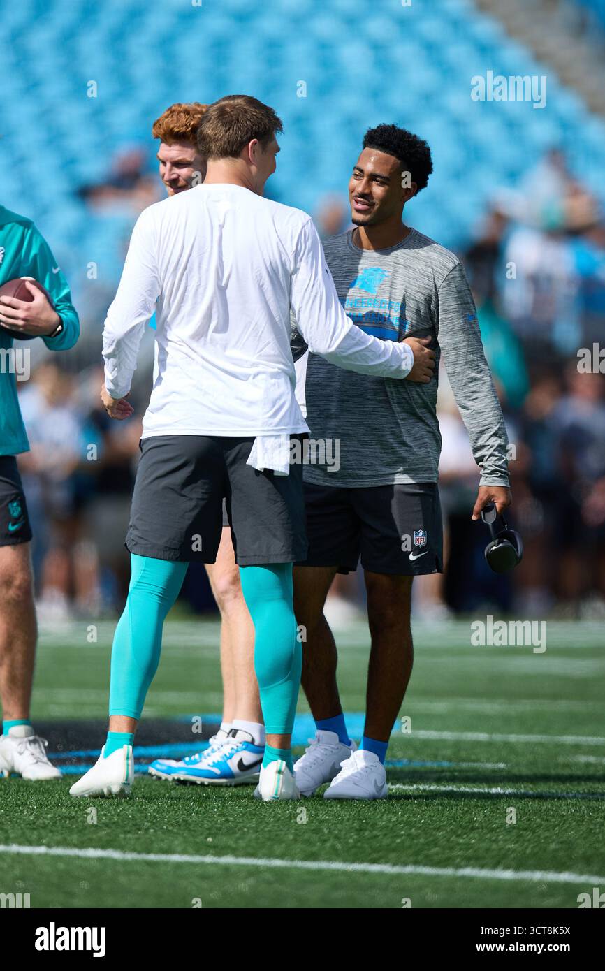Carolina Panthers quarterback Bryce Young (right) chats with Miami ...