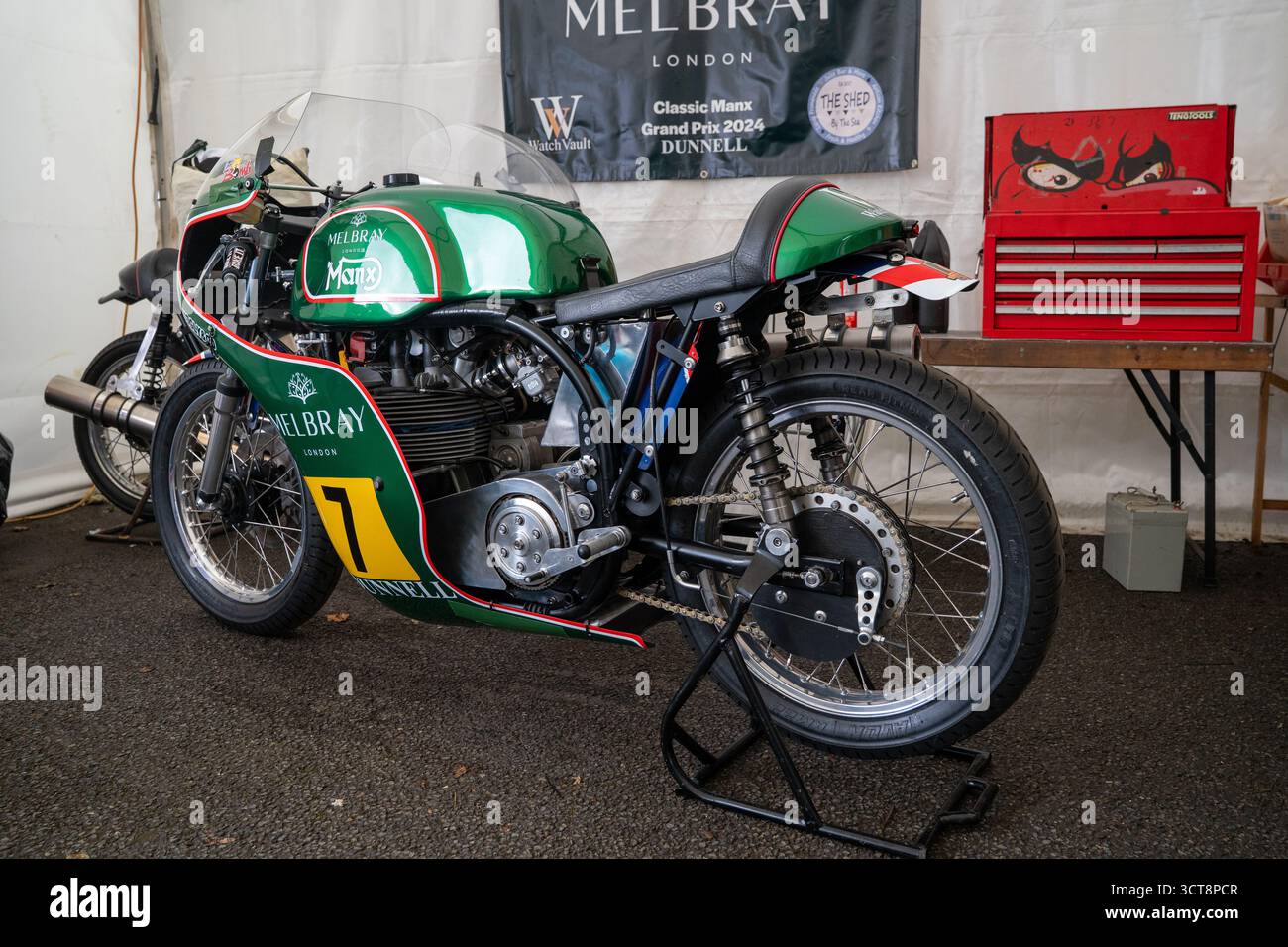 Classic green Meldray racing motorcycle number 1 in garage with Dunnell ...