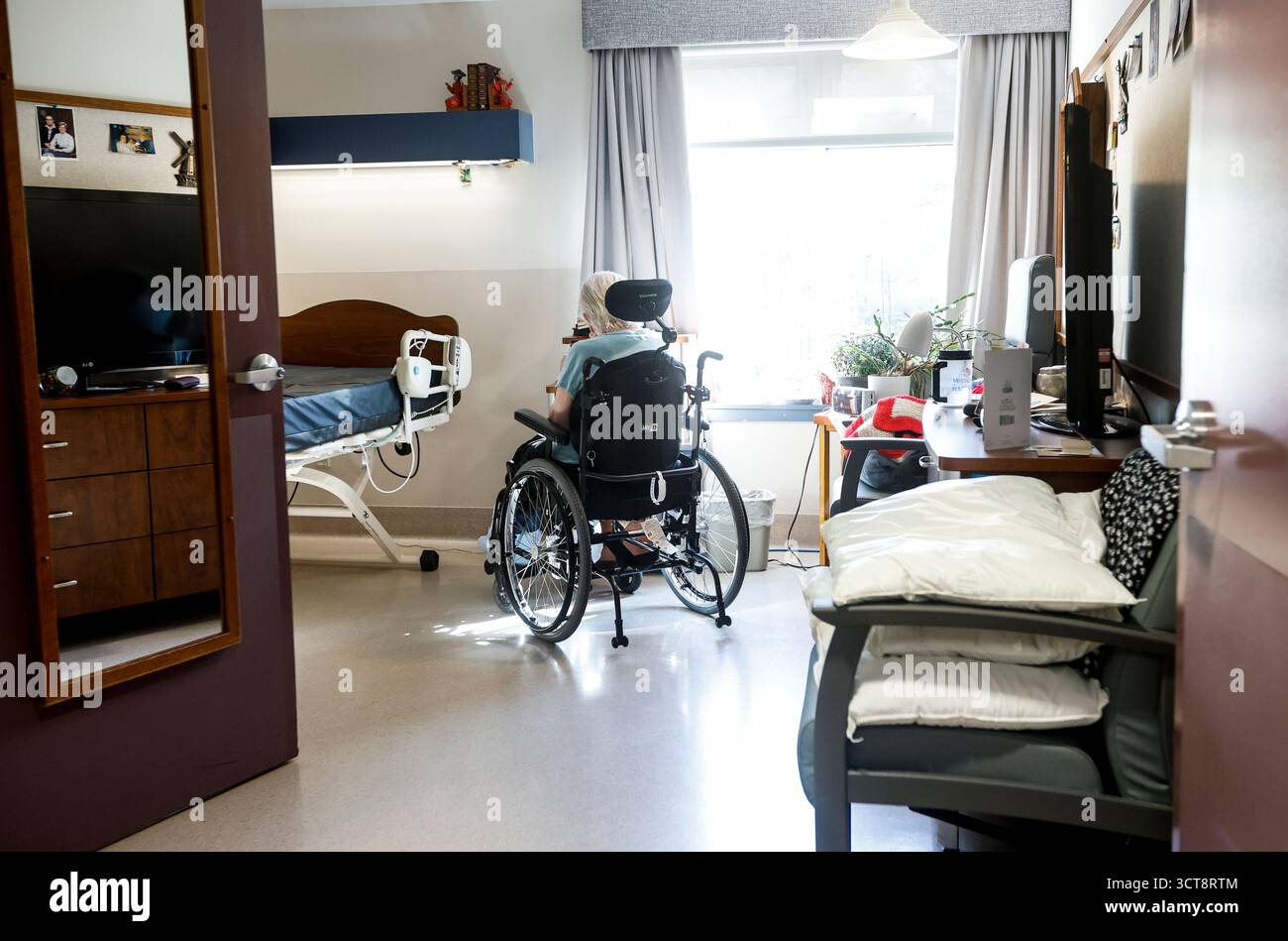 A resident at Misericordia Place Personal Care Home (MPPCH) waits to be ...