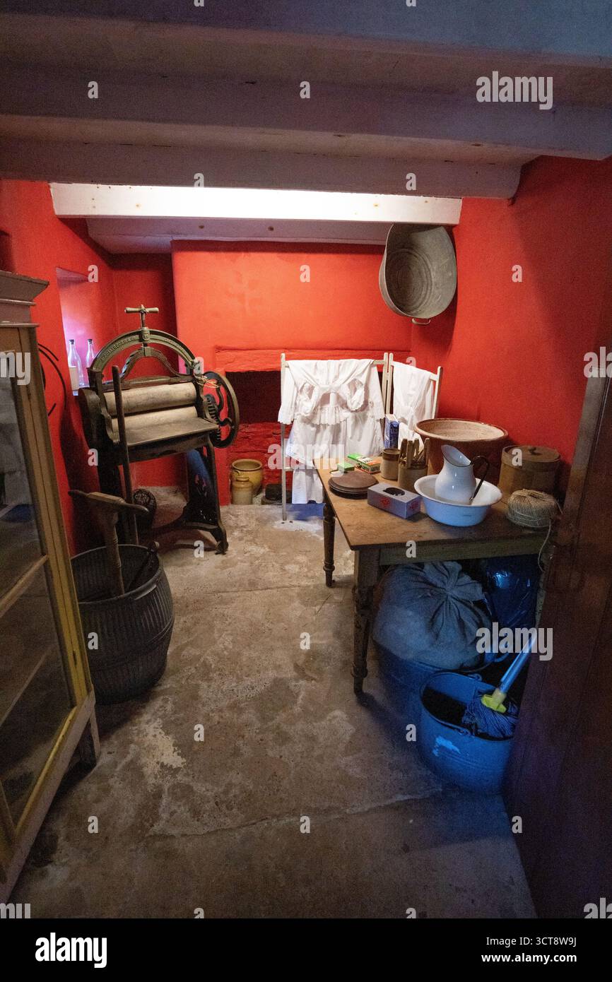 Traditional laundry room with mangle and washing equipment in historic ...