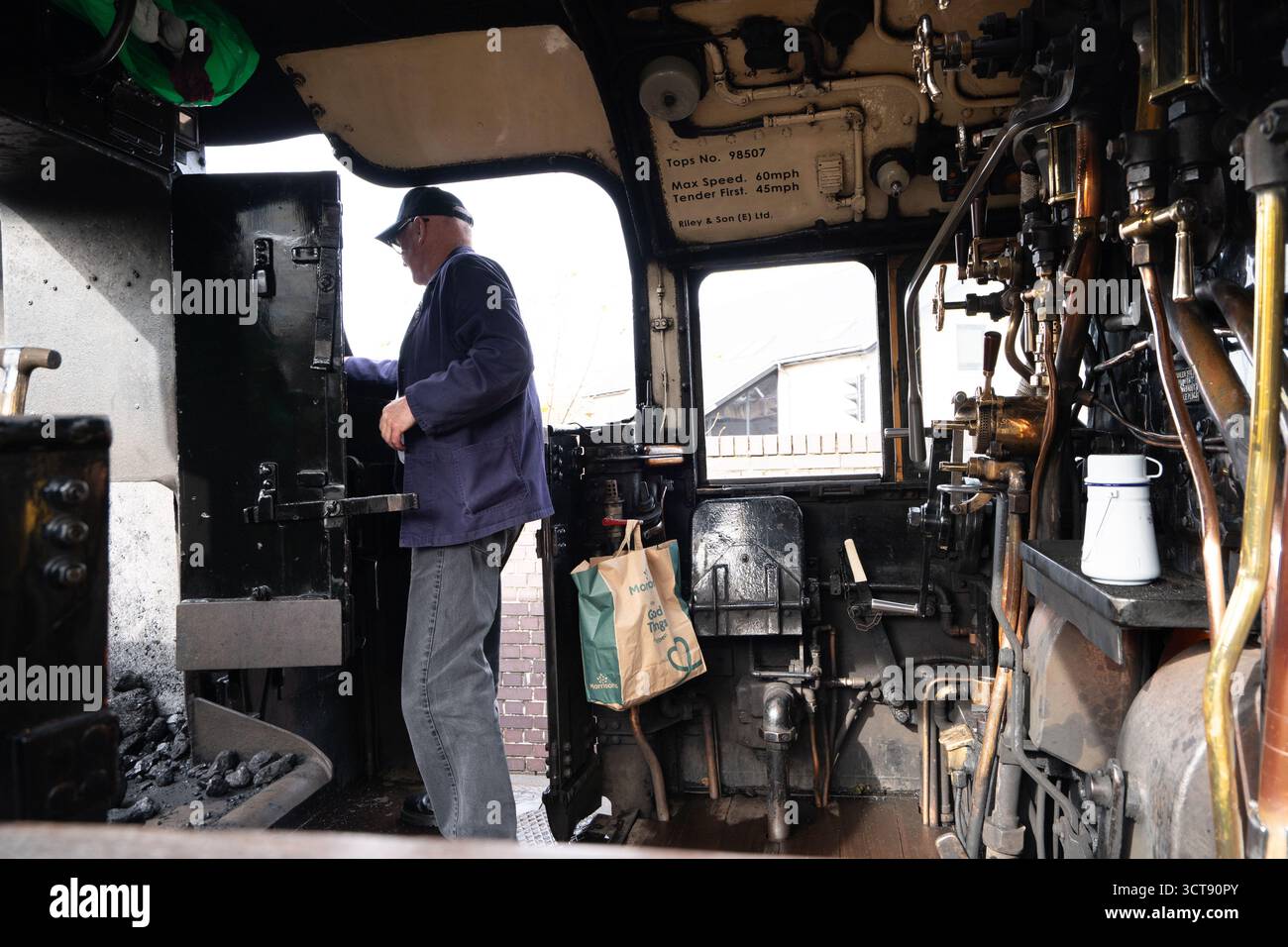 Steam locomotive driver in cab operating vintage railway engine Stock ...