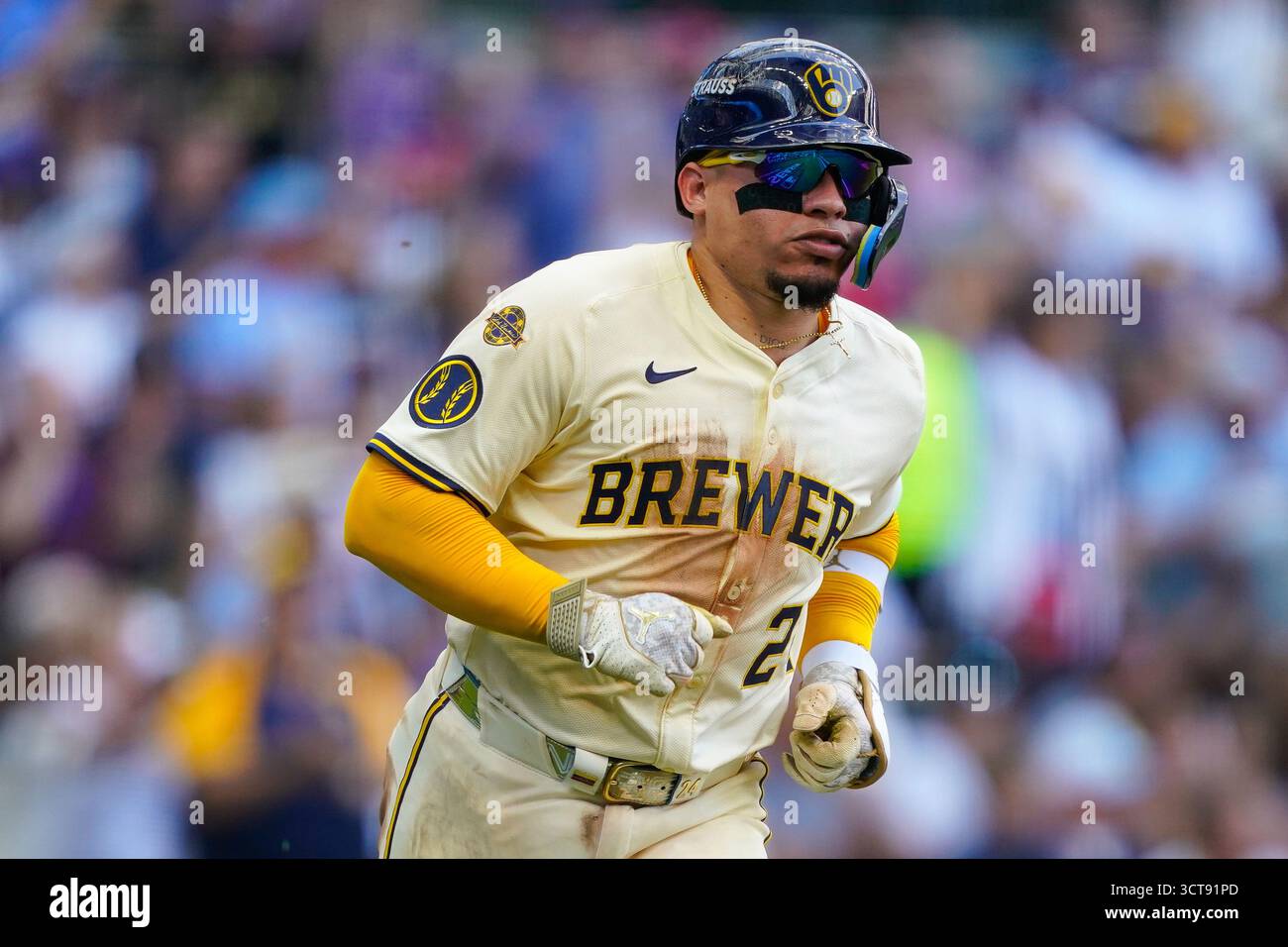 Milwaukee Brewers' William Contreras runs down the first base line ...