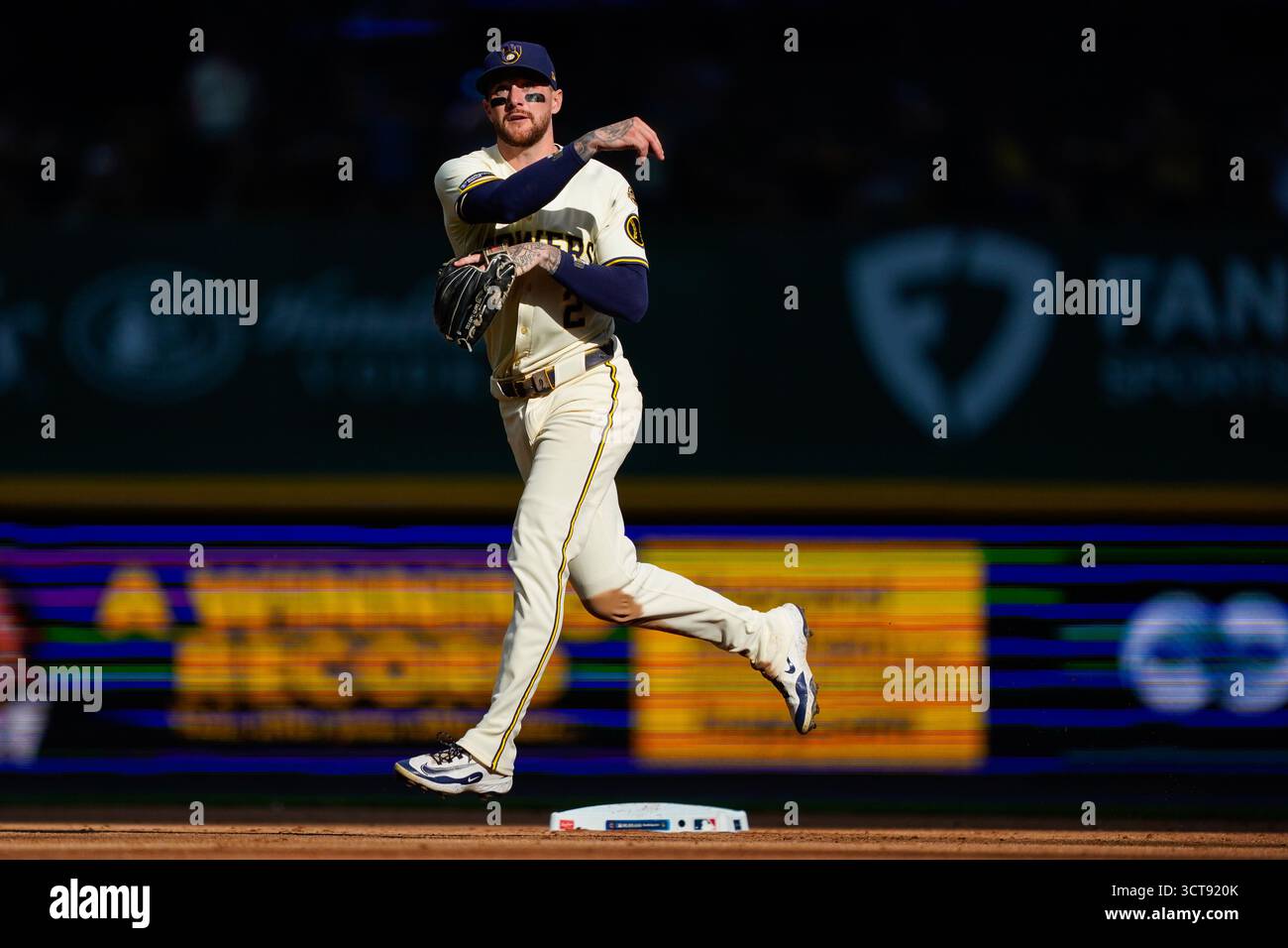 Milwaukee Brewers second baseman Brice Turang follows through on a ...