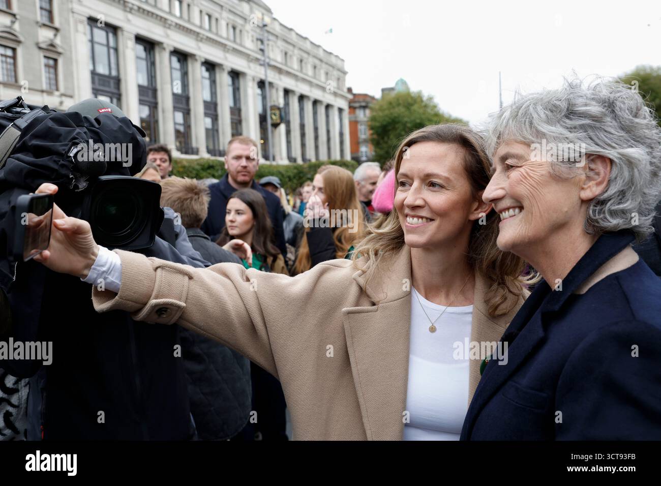 Holly Cairns TD, leader of the Social Democrats, takes a selfie with ...
