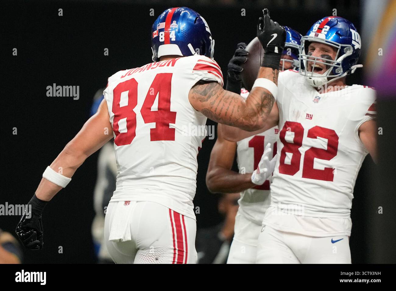New York Giants tight end Theo Johnson (84) celebrates his touchdown ...