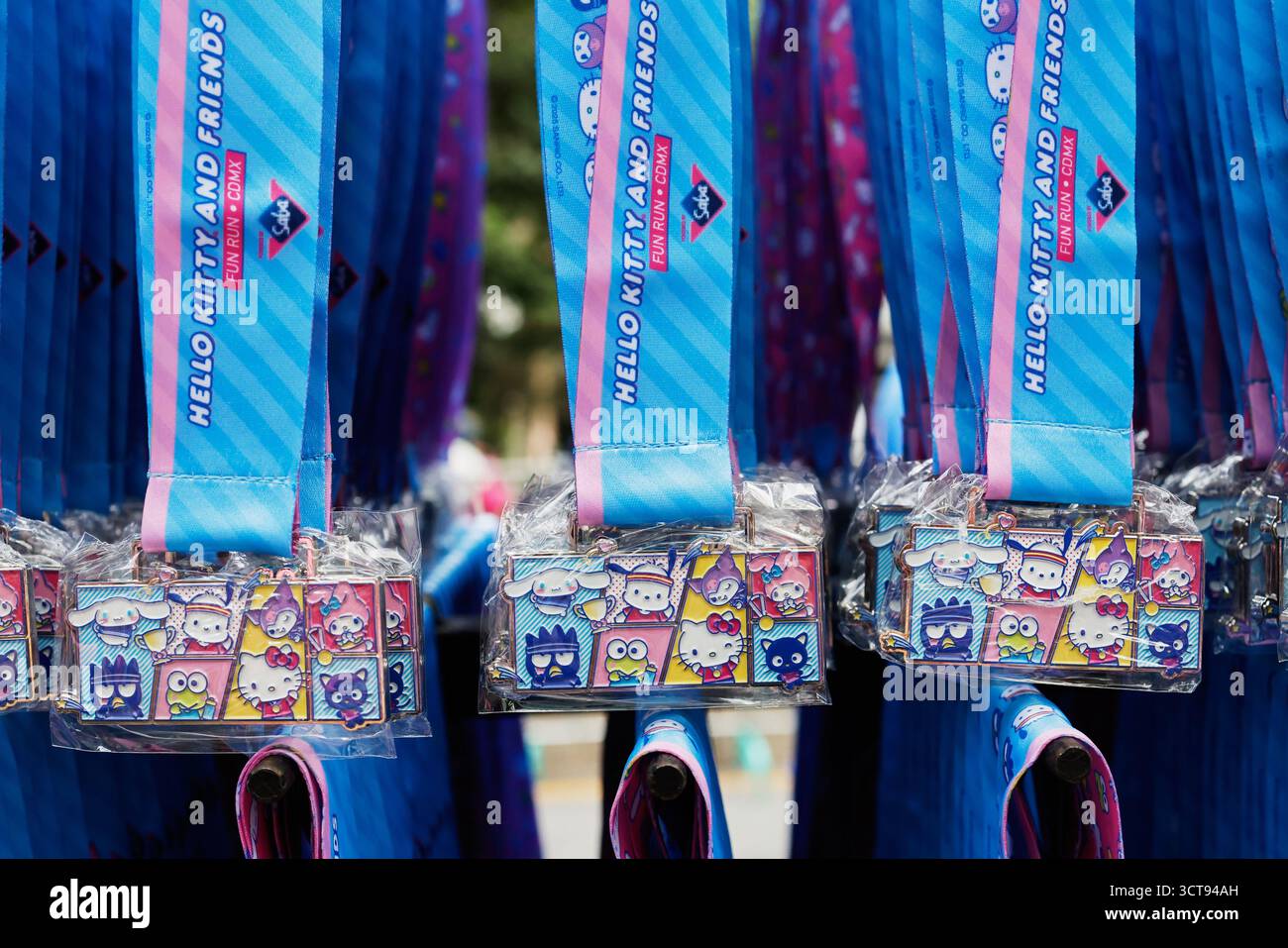Hello Kitty-themed medals hang ready to be given to participants in a ...