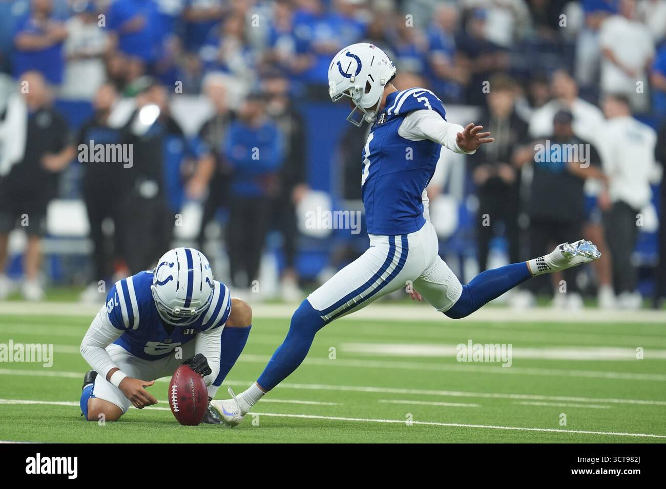 Indianapolis Colts kicker Spencer Shrader (3) kicks an extra point out ...