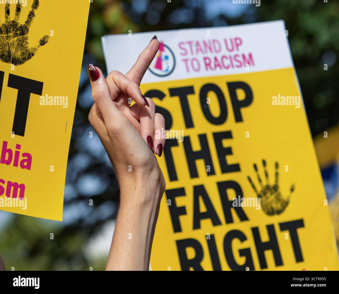 Bristol, UK. 5th Oct, 2025. An Anti racism activist is pictured in the ...