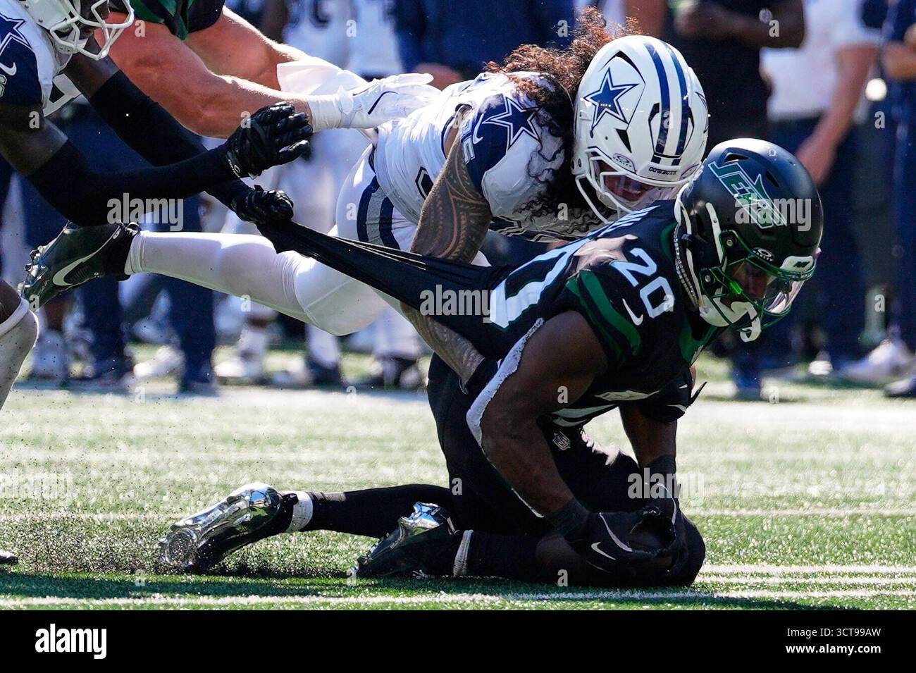 New York Jets' Breece Hall fumbles as he is hit by Dallas Cowboys ...