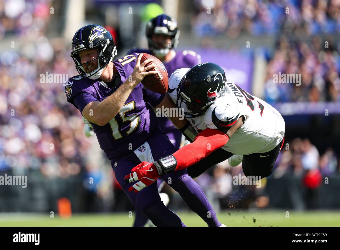 Baltimore Ravens quarterback Cooper Rush (15) is sacked by Houston ...