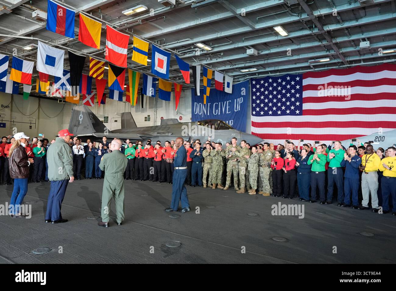 President Donald Trump and first lady Melania Trump talk to sailors as ...