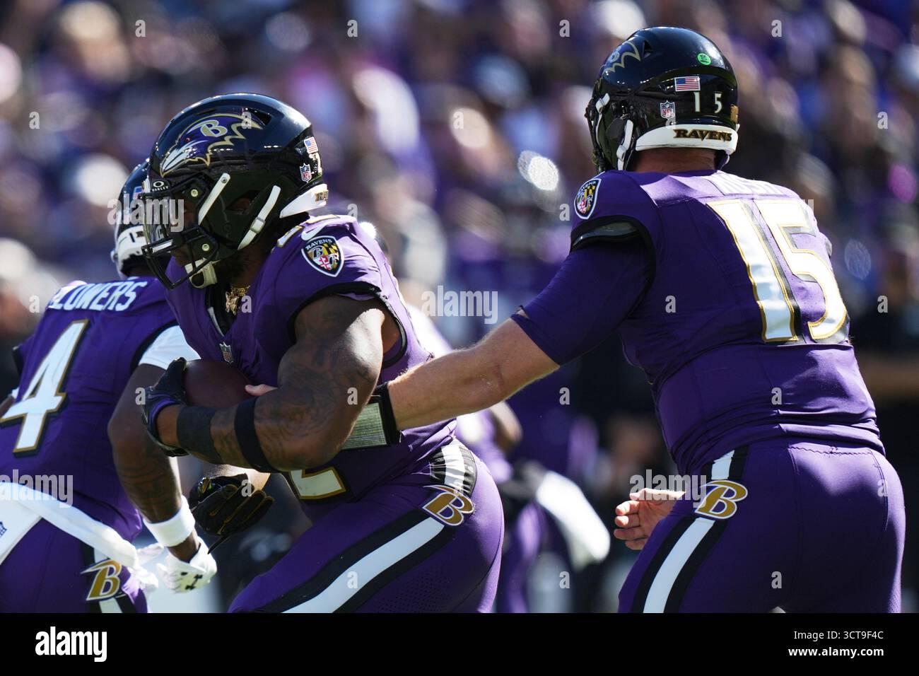 Baltimore Ravens quarterback Cooper Rush (15) hands off the ball to ...