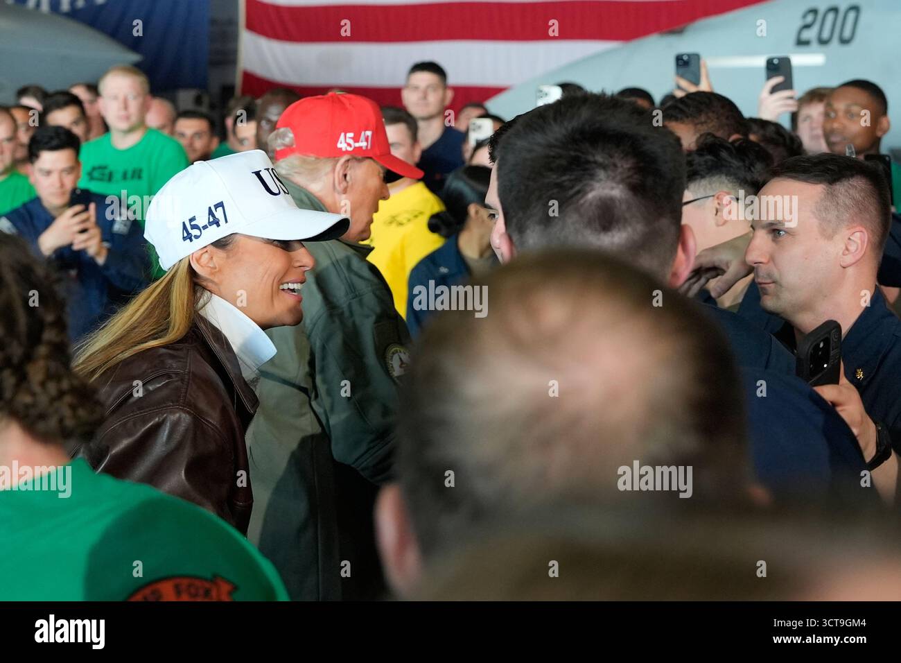 President Donald Trump and first lady Melania Trump greet sailors as ...
