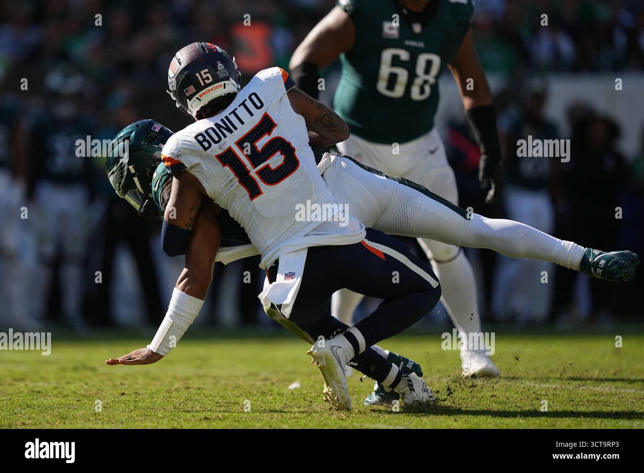 Denver Broncos linebacker Nik Bonitto (15) tackles Philadelphia Eagles ...