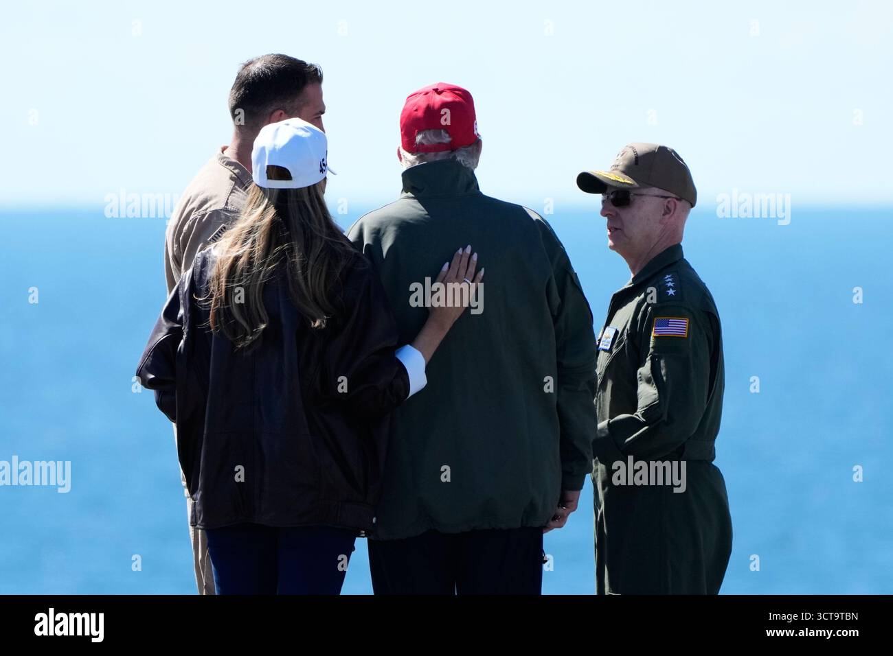 President Donald Trump and first lady Melania Trump watch a naval sea ...