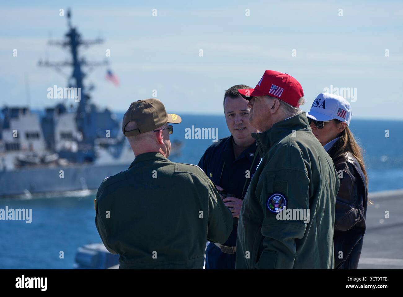 President Donald Trump and first lady Melania Trump watch a naval sea ...
