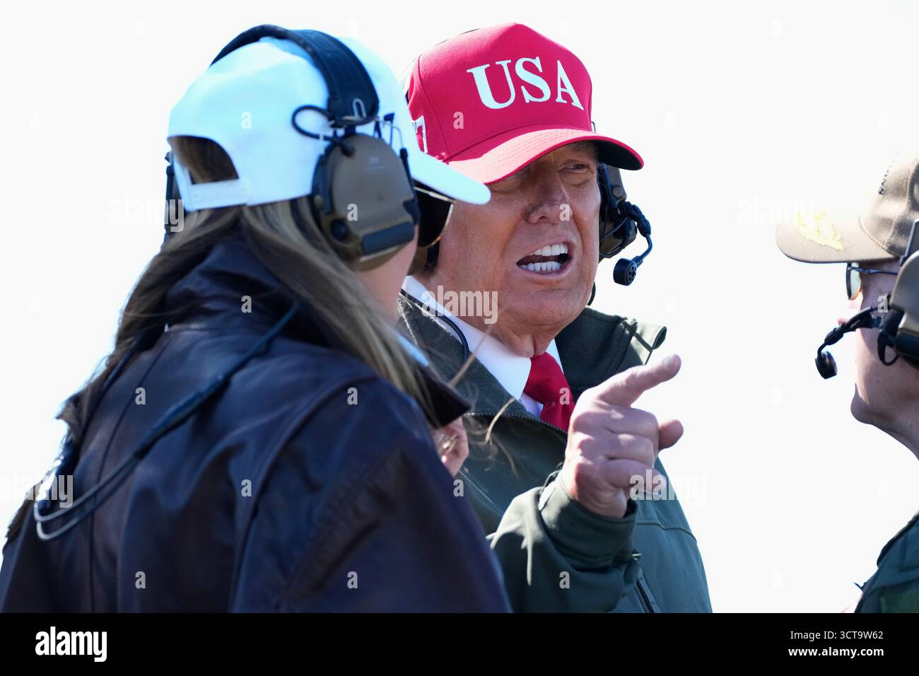 President Donald Trump and first lady Melania Trump watch a naval sea ...