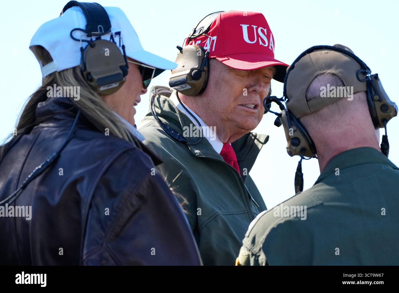 President Donald Trump and first lady Melania Trump watch a naval sea ...