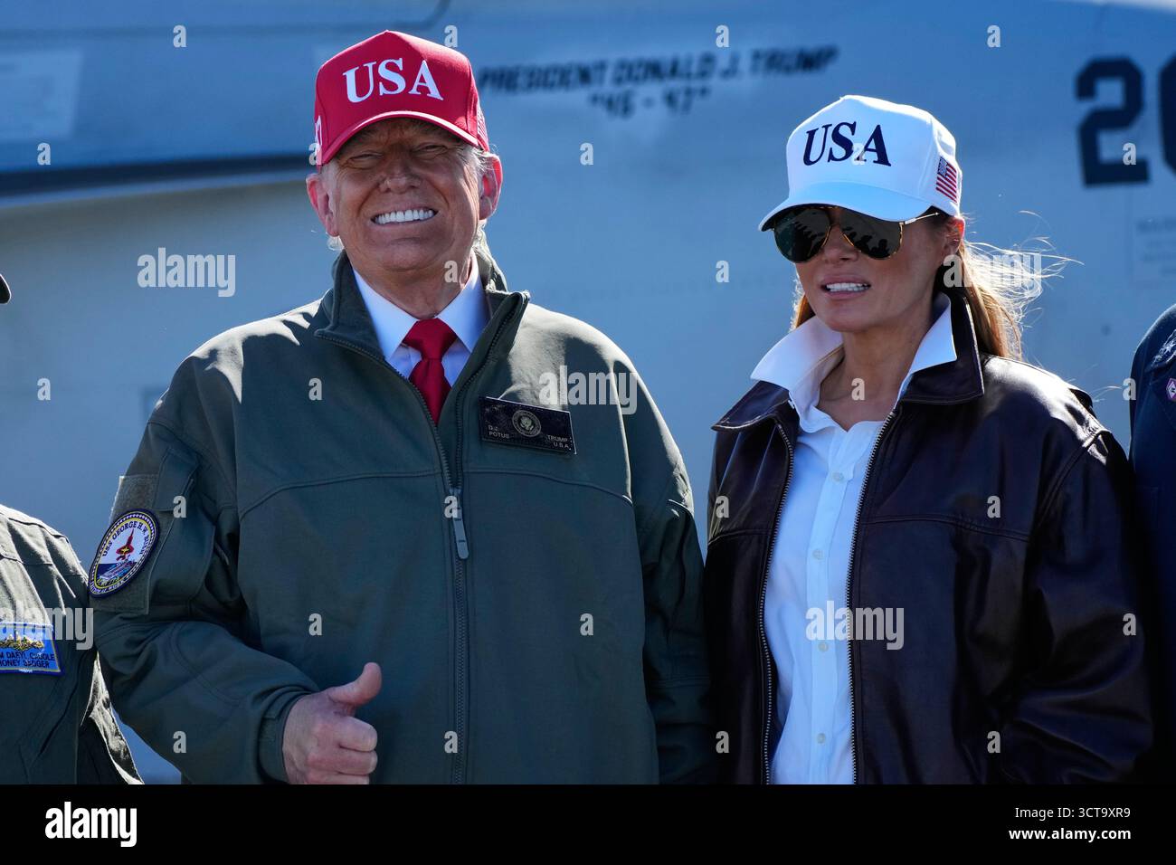 President Donald Trump and first lady Melania Trump pose in front of a ...