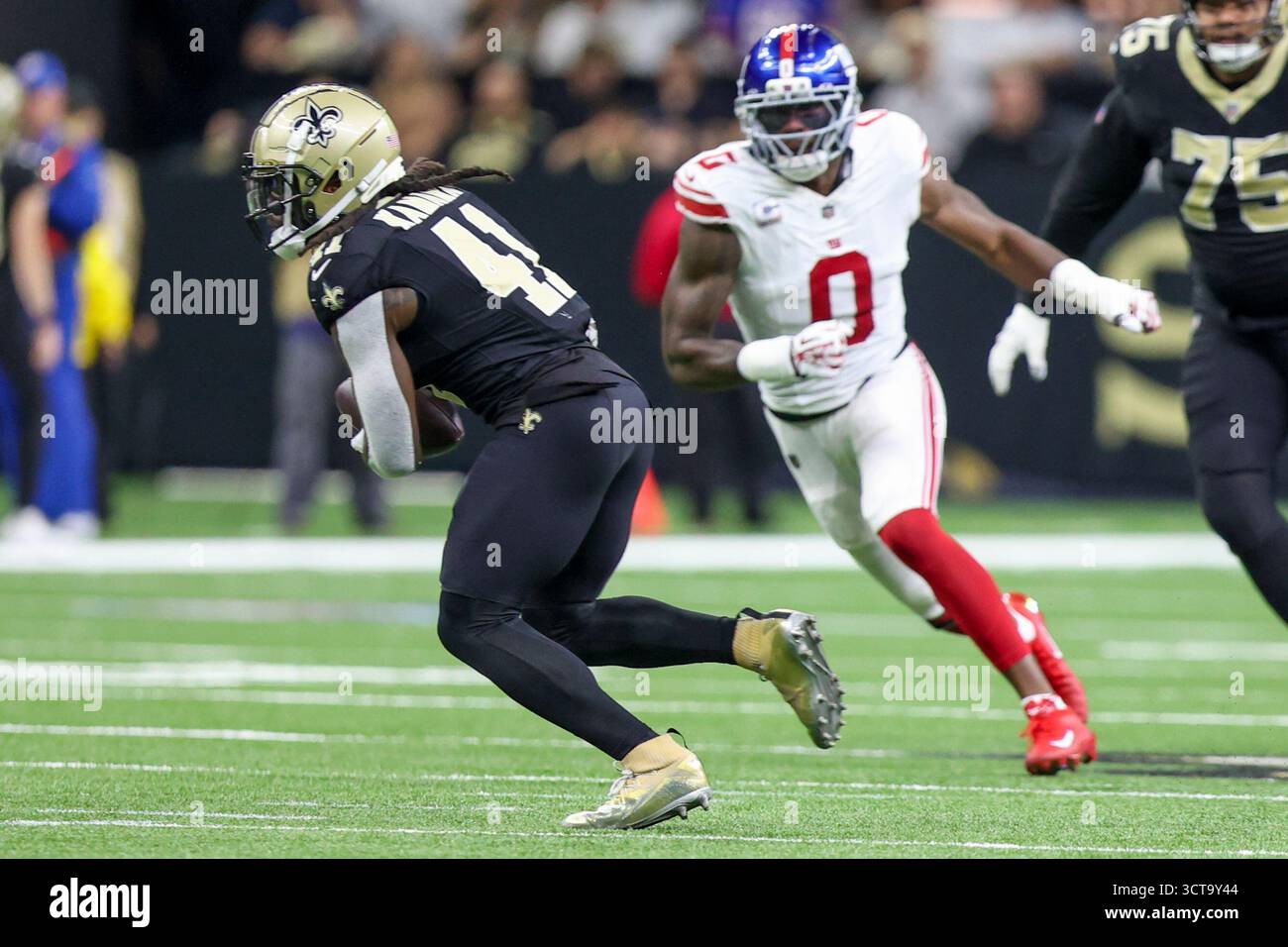 New Orleans Saints running back Alvin Kamara (41) tries to gain some ...