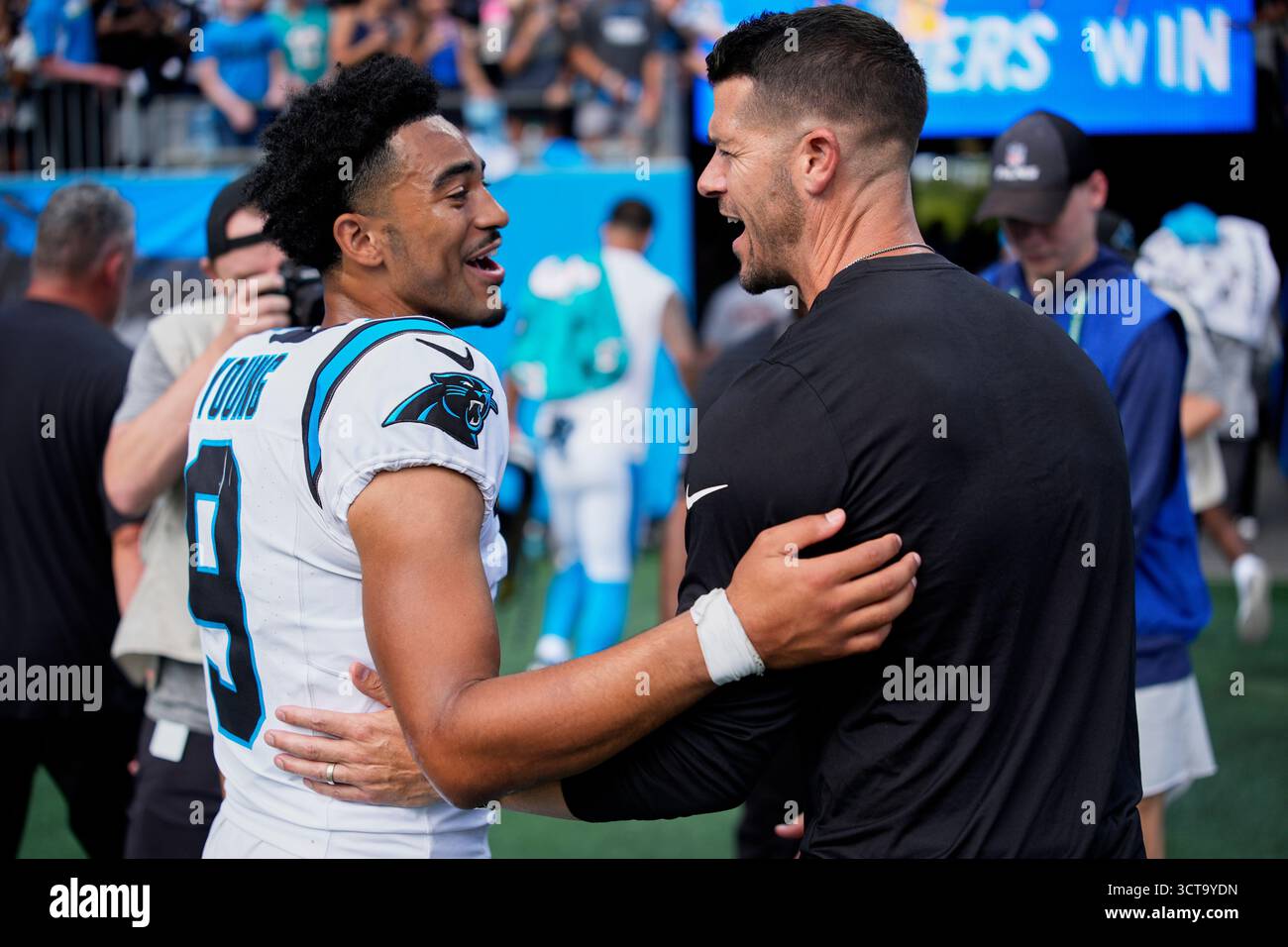 Carolina Panthers quarterback Bryce Young and head coach Dave Canales hug after an NFL football ...