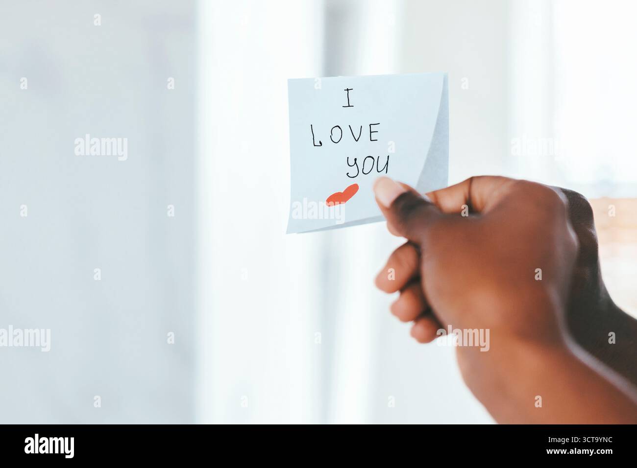 Black Female Hand Putting Sticky Note With Romantic Message On Mirror ...