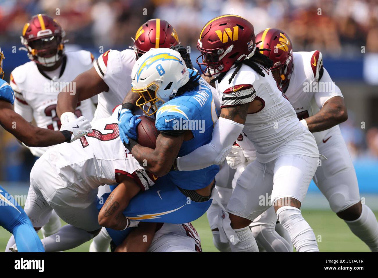Los Angeles Chargers running back Omarion Hampton (8) is tackled by ...