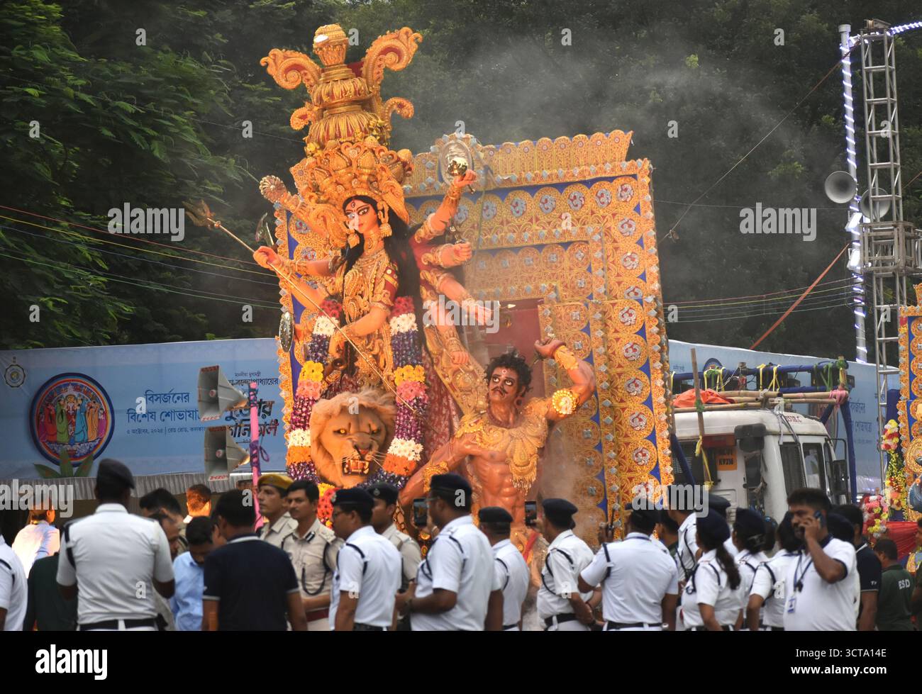 Kolkata police officers stand beside a Durga idol during the Durga Puja ...