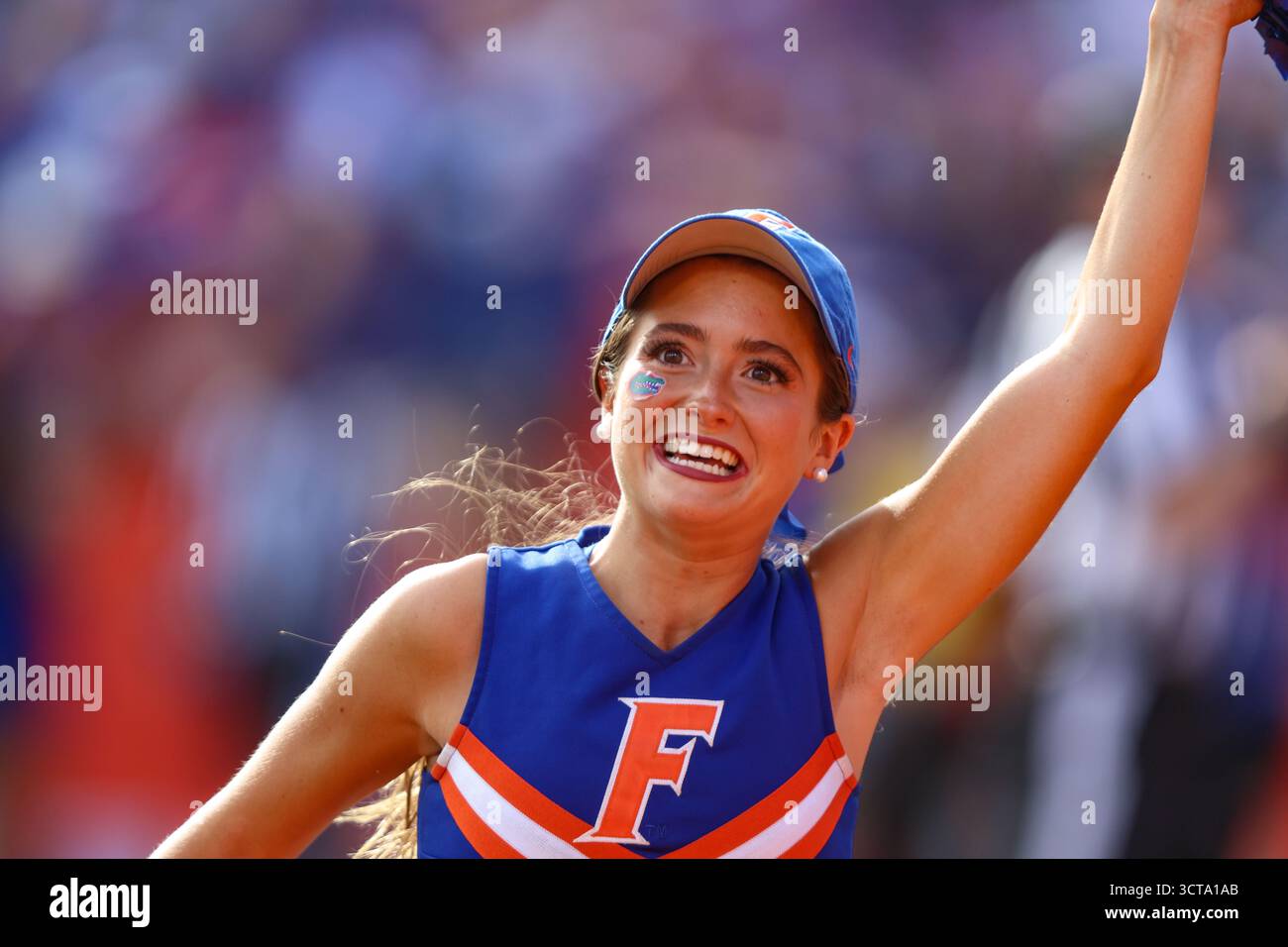 Member of the Florida cheer squad performs during an NCAA football game ...