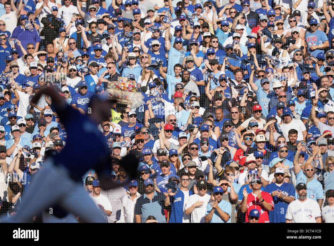 The crowd looks on as Toronto Blue Jays pitcher Trey Yesavage works ...