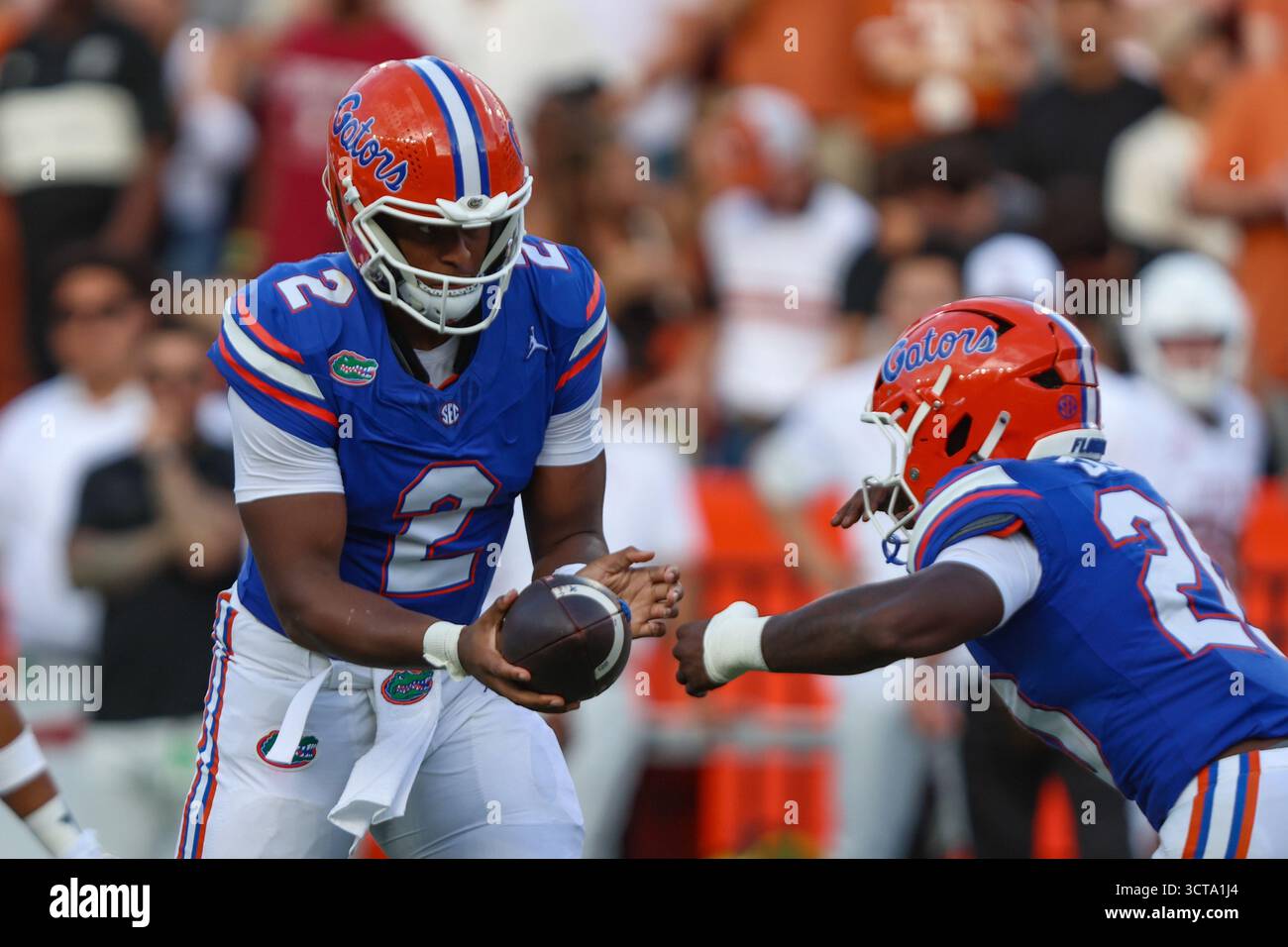 Florida quarterback DJ Lagway (2) hands-off the ball to running back ...