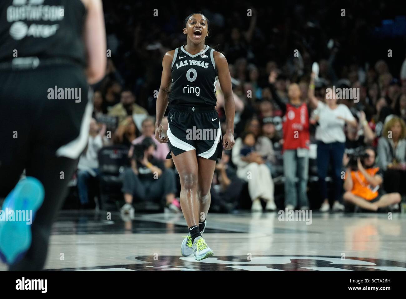 Las Vegas Aces guard Jackie Young (0) celebrates after making a 3-point ...