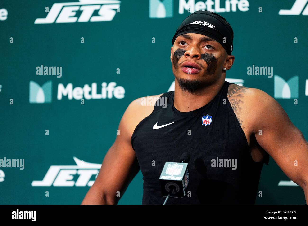 New York Jets' Justin Fields talks after an NFL football game against ...